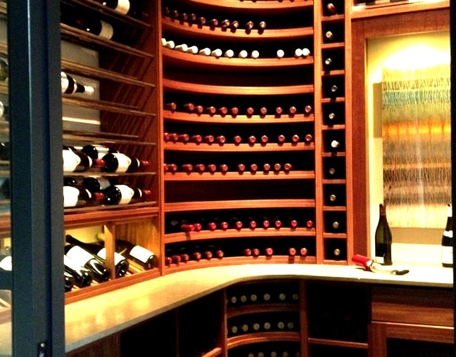 Mid-sized transitional ceramic tile wine cellar design with racks ...